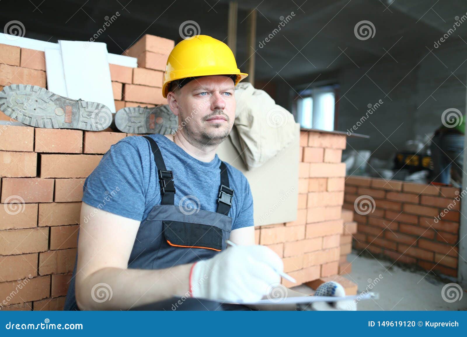 Concerned man in hardhat stock photo. Image of male - 149619120
