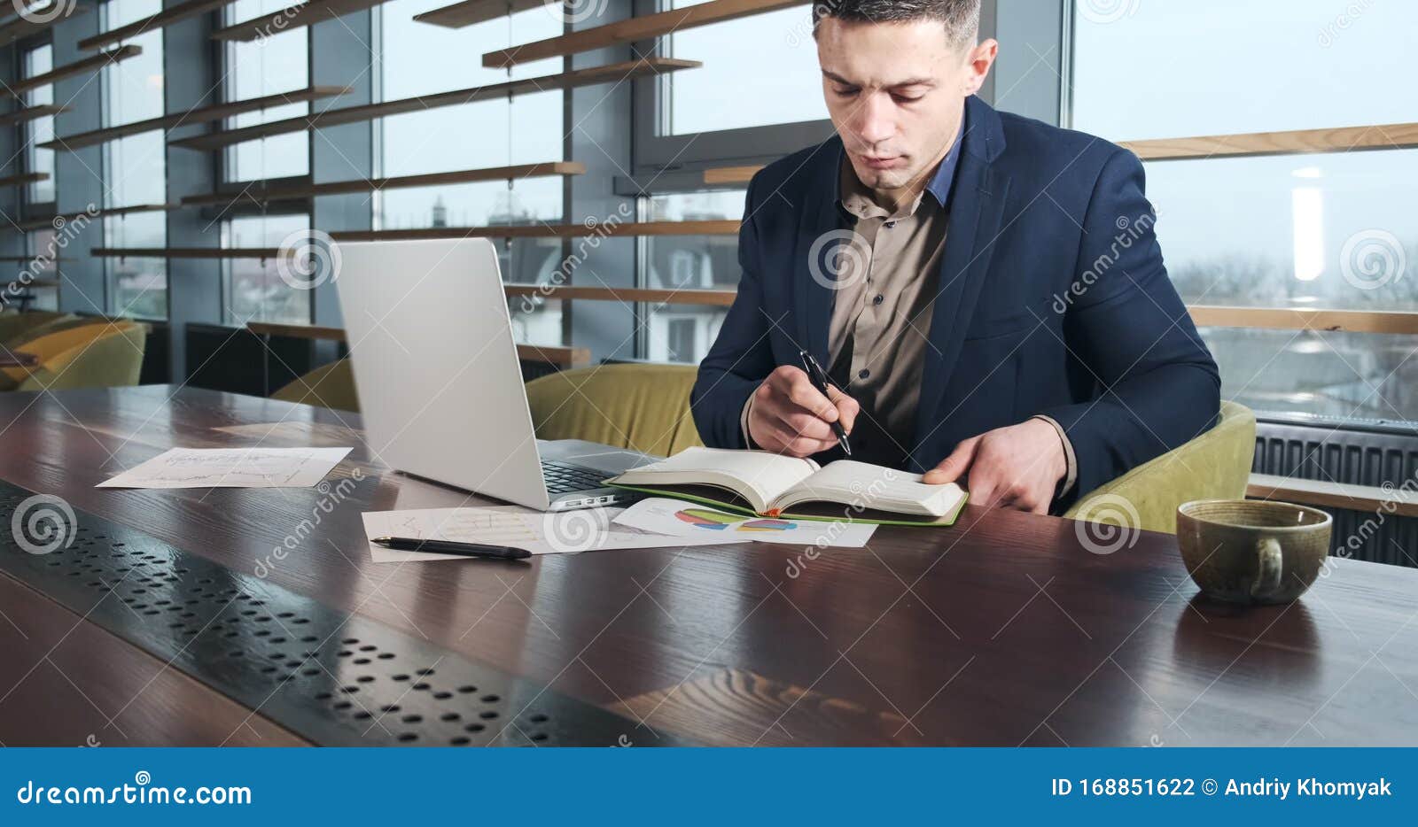Concerned Man Working on Laptop Computer and Looking Away Thinking ...