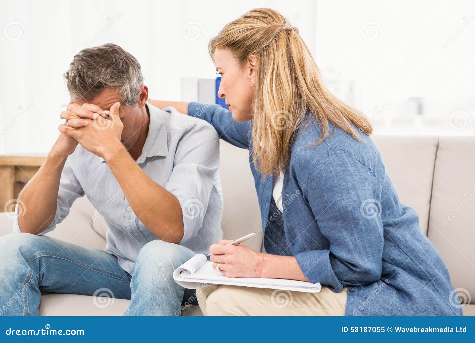 Concerned Therapist Comforting Male Patient Stock Image - Image of ...