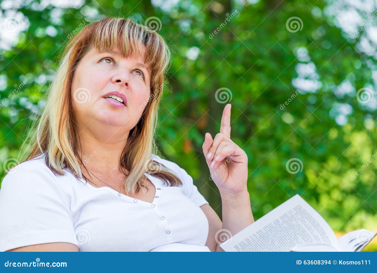 Concerned woman with book stock photo. Image of bench - 63608394
