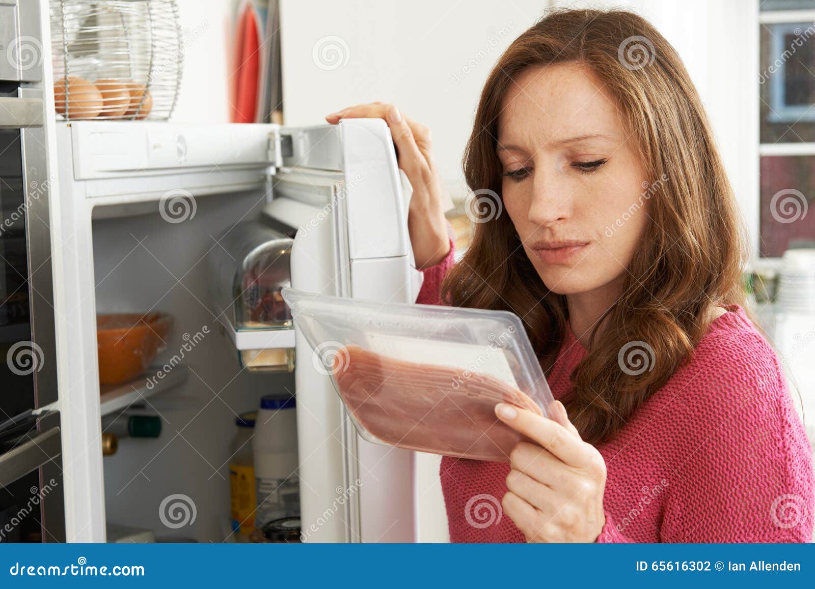 Concerned Woman Looking at Pre Packaged Meat Stock Photo - Image of ...
