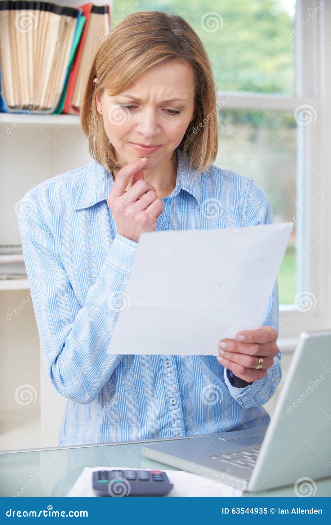 Concerned Woman Reading Letter in Home Office Stock Image - Image of ...
