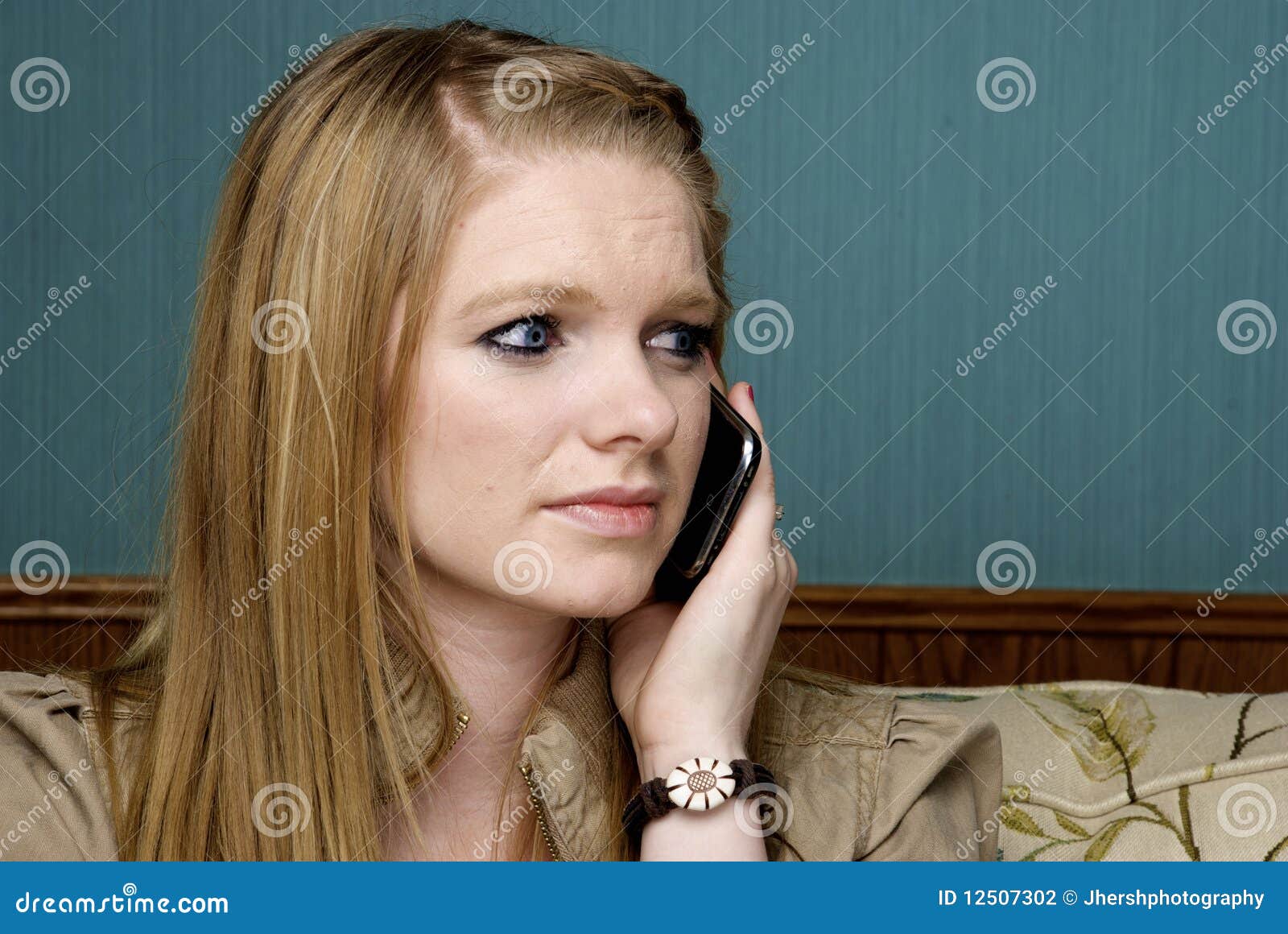 Concerned Young Woman on Cell Phone Stock Photo - Image of jewelry ...