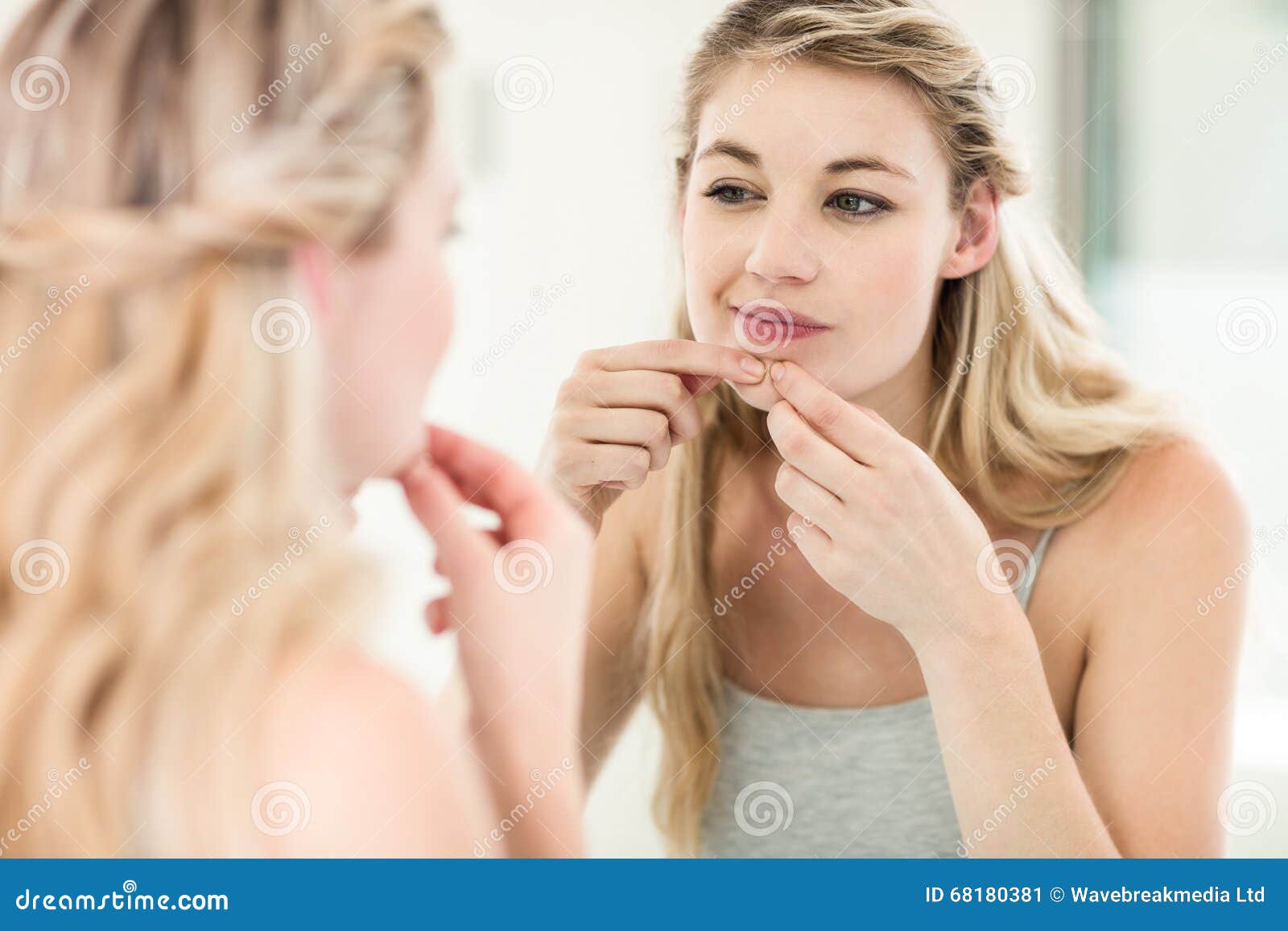 Concerned Young Woman Looking in Mirror Stock Image - Image of ...
