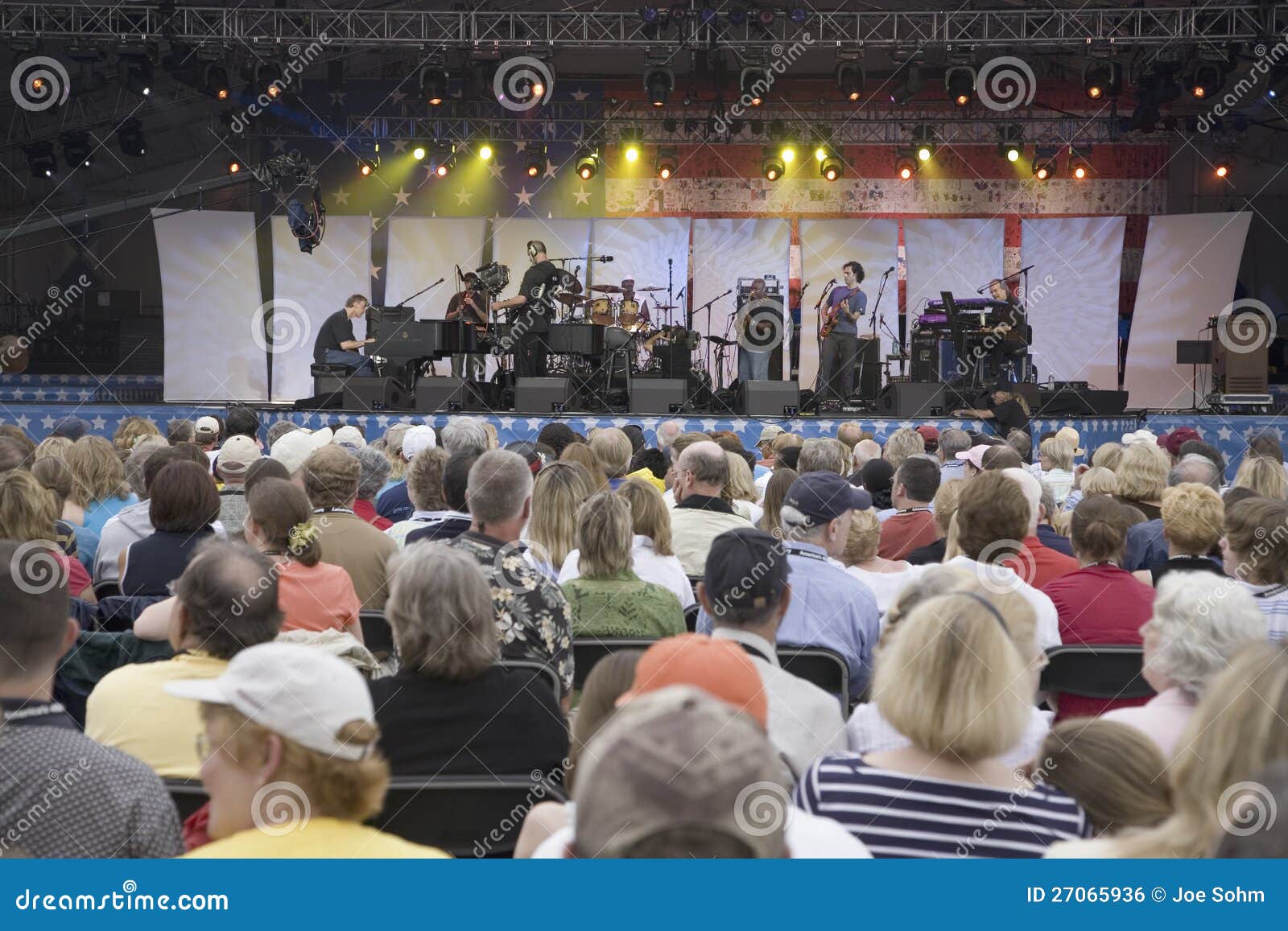 Concert And Audience. People Watch A Group Of Musicians And A Singer ...