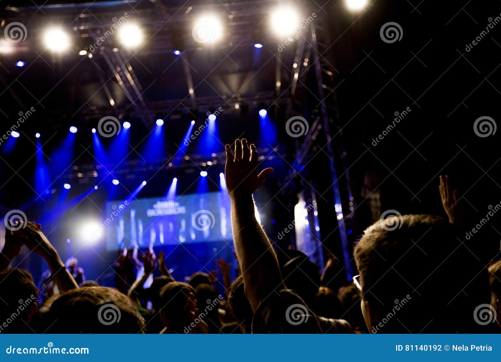 Concert Crowd in Front of Bright Stage Lights Stock Photo - Image of ...