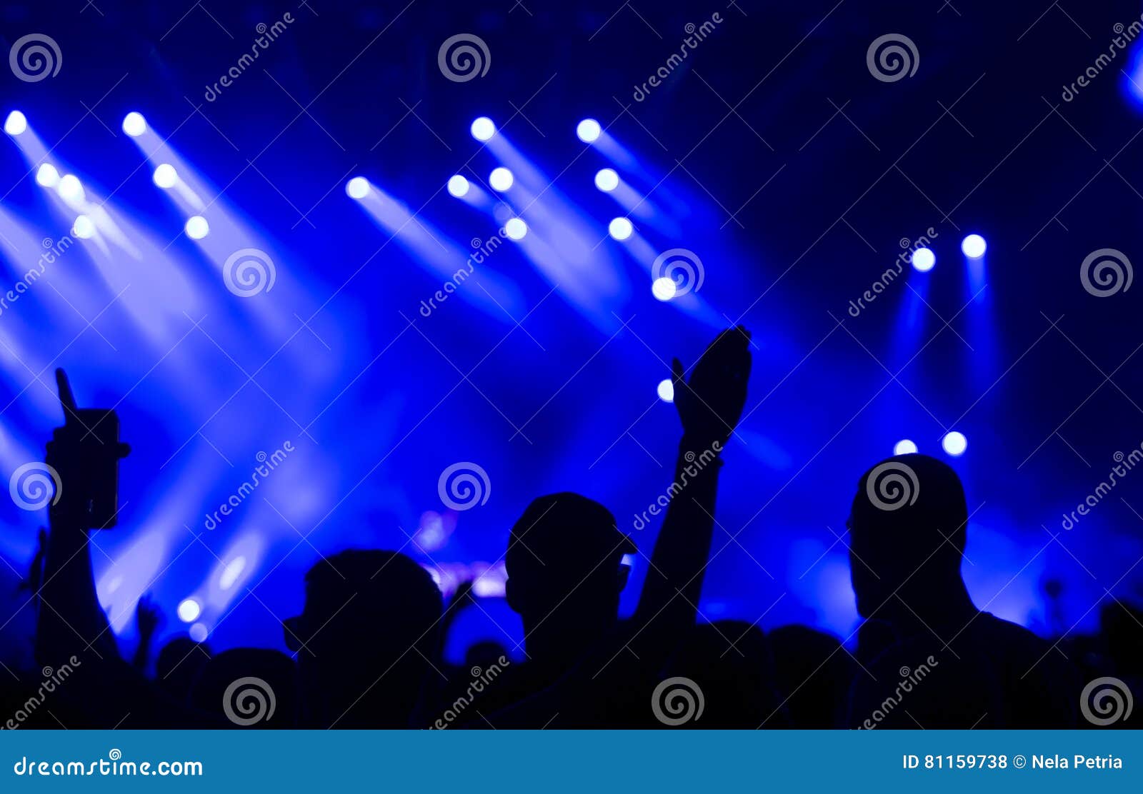 Concert Crowd in Front of Bright Stage Lights Stock Photo - Image of ...
