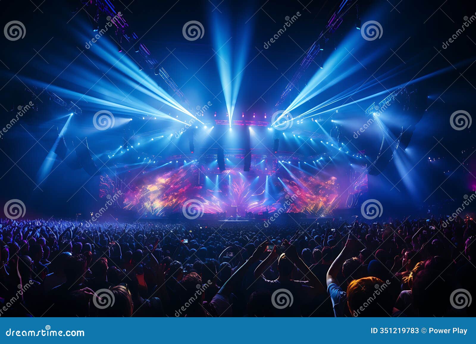 Concert Crowd in Front of a Bright Stage with Lights and Smoke Stock ...