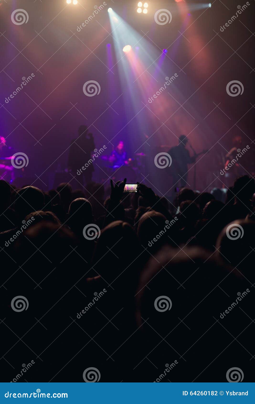 Concert Goer Taking Photos with Mobile of Rock Band. Stock Photo ...