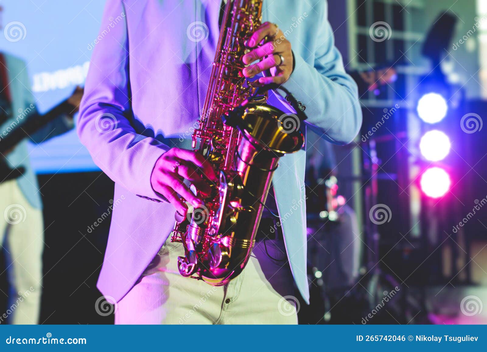 Concert View of Saxophonist, a Saxophone Sax Player with Vocalist and ... Concert View of Saxophonist, a Saxophone Sax Player with Vocalist and ...