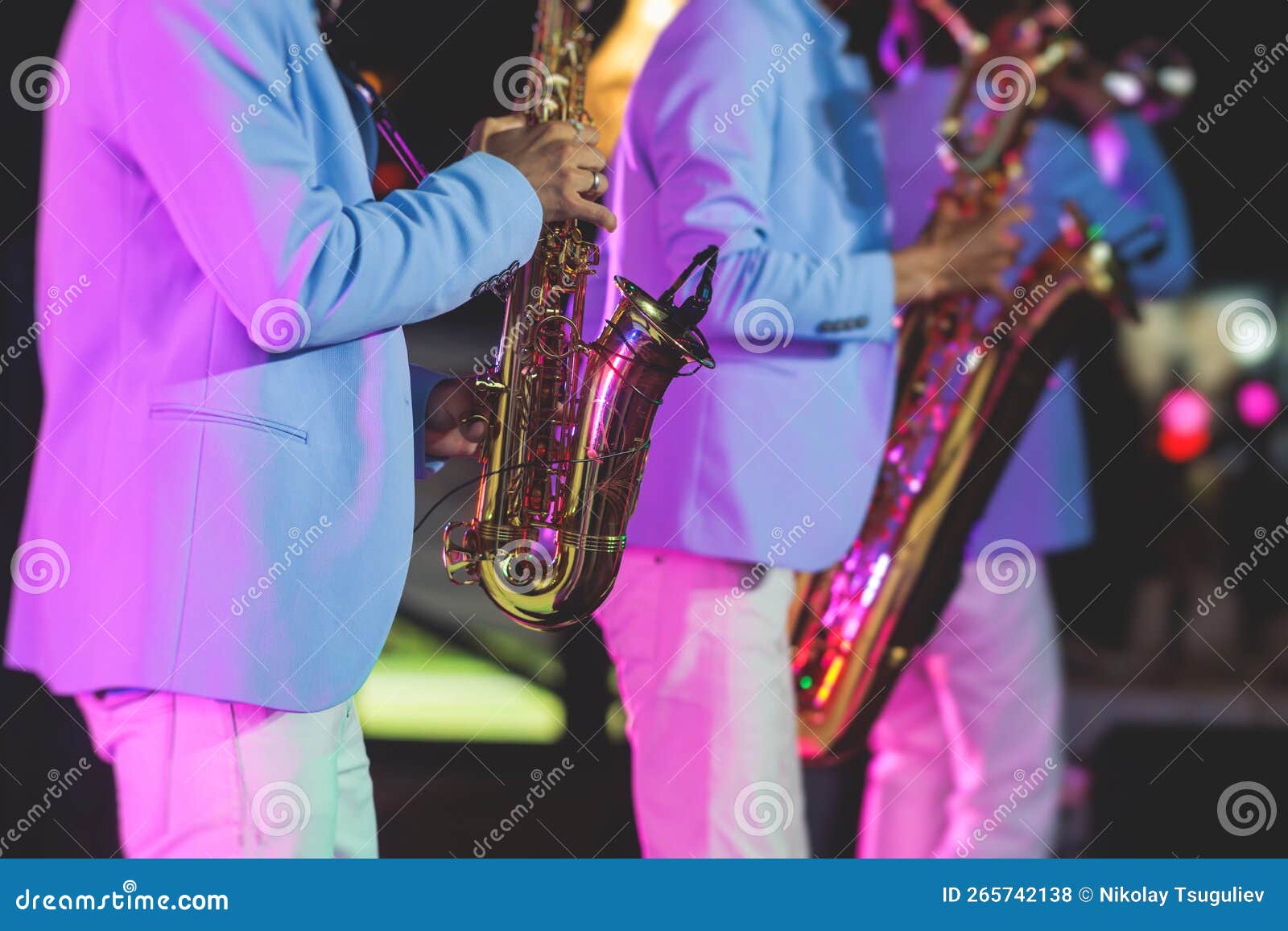 Concert View of Saxophonist, a Saxophone Sax Player with Vocalist and ... Concert View of Saxophonist, a Saxophone Sax Player with Vocalist and ...
