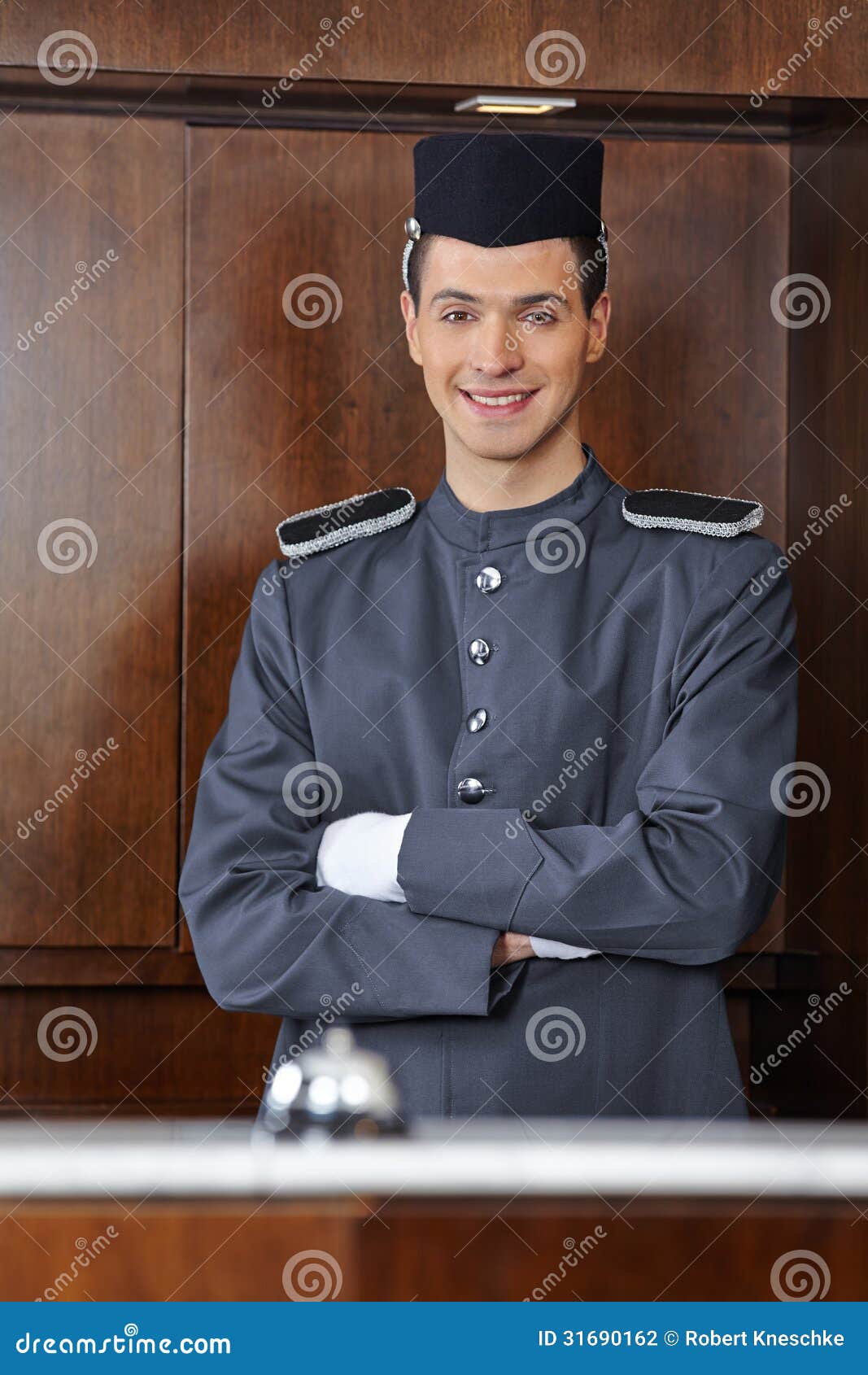 Concierge in Hotel with Arms Crossed Stock Photo - Image of people ...