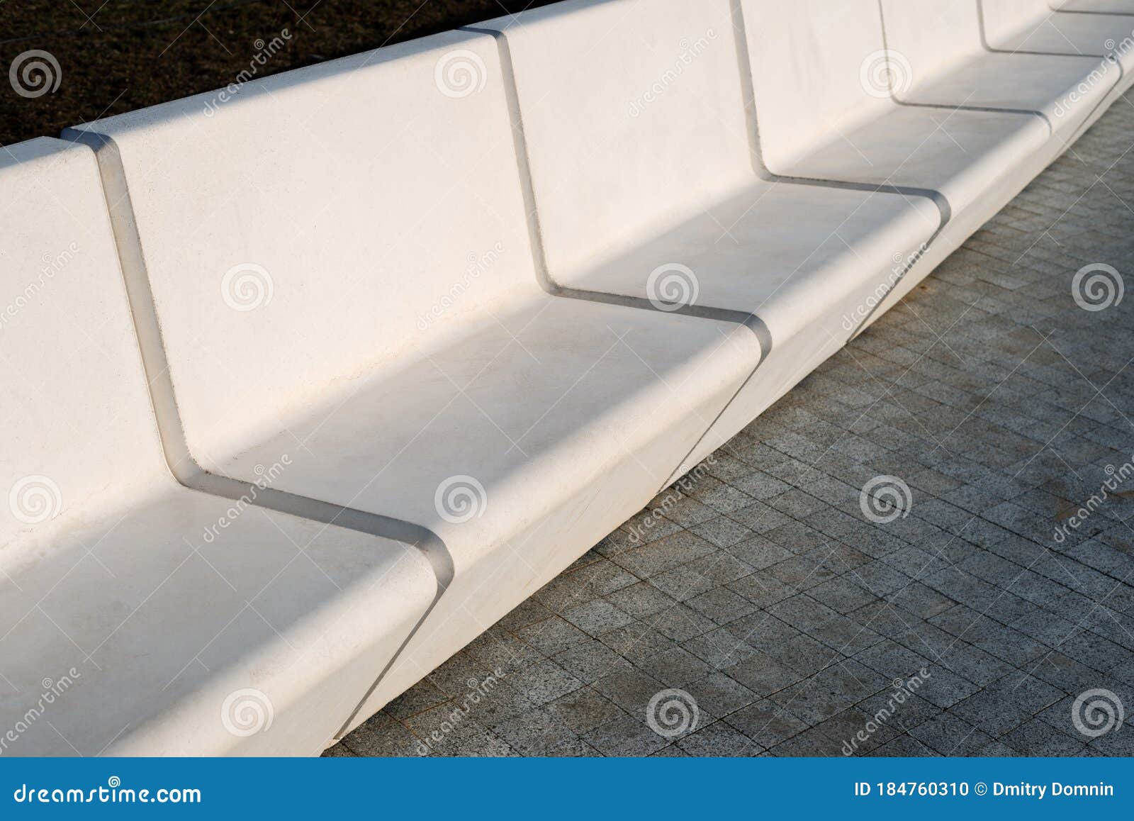 Concrete Bench on the Natural Stone Blocks Pavement Stock Photo - Image ...