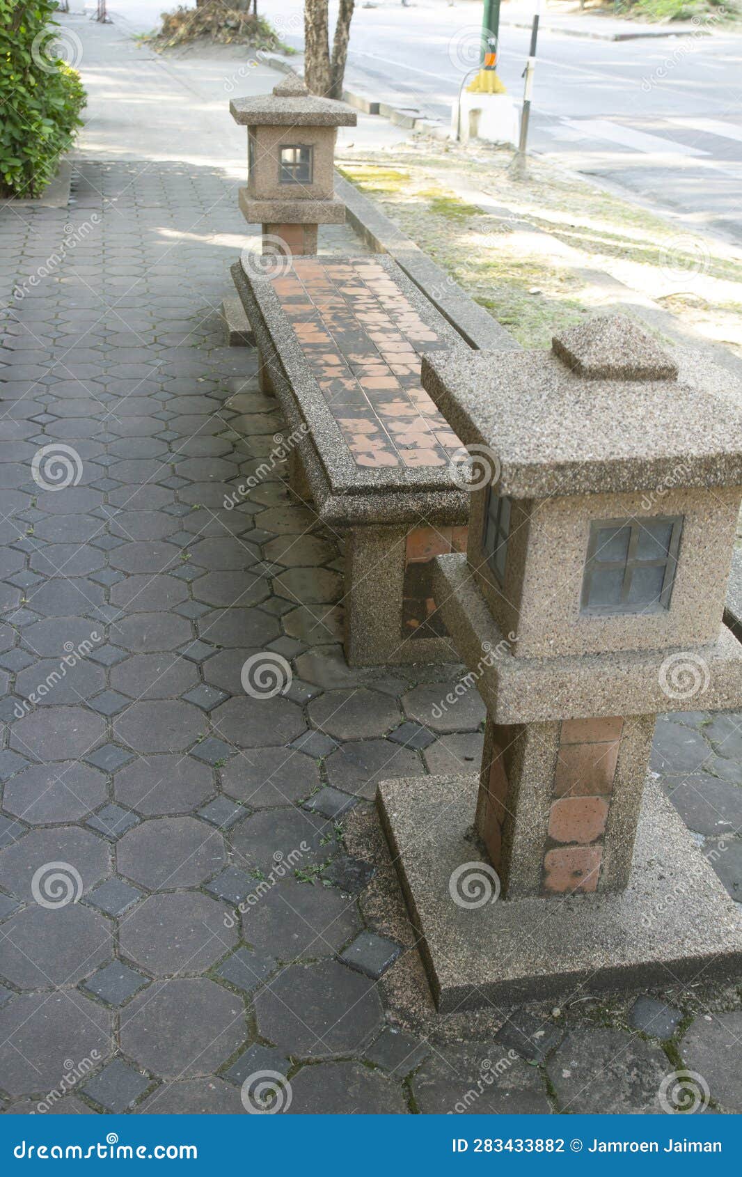 A Concrete Bench beside the Sidewalk that Sat on the Side of the Road ...