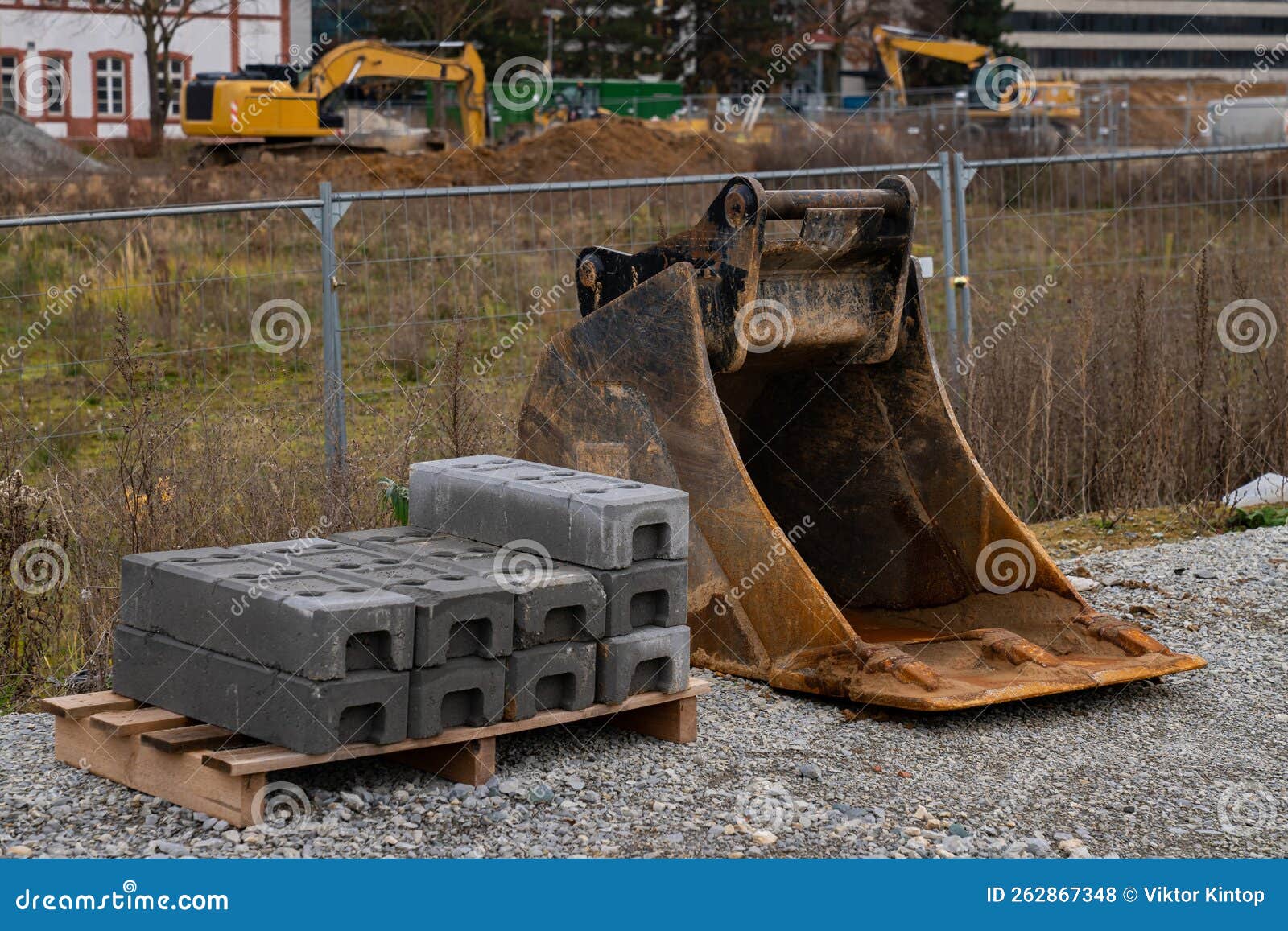 Concrete Blocks and Bulldozer Bucket at Construction Site Stock Photo ...