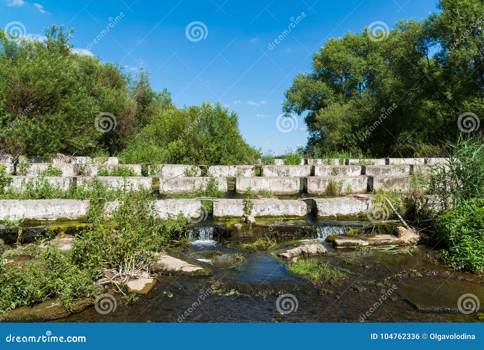 Concrete Blocks Lying on a Small River - Dam Stock Photo - Image of ...