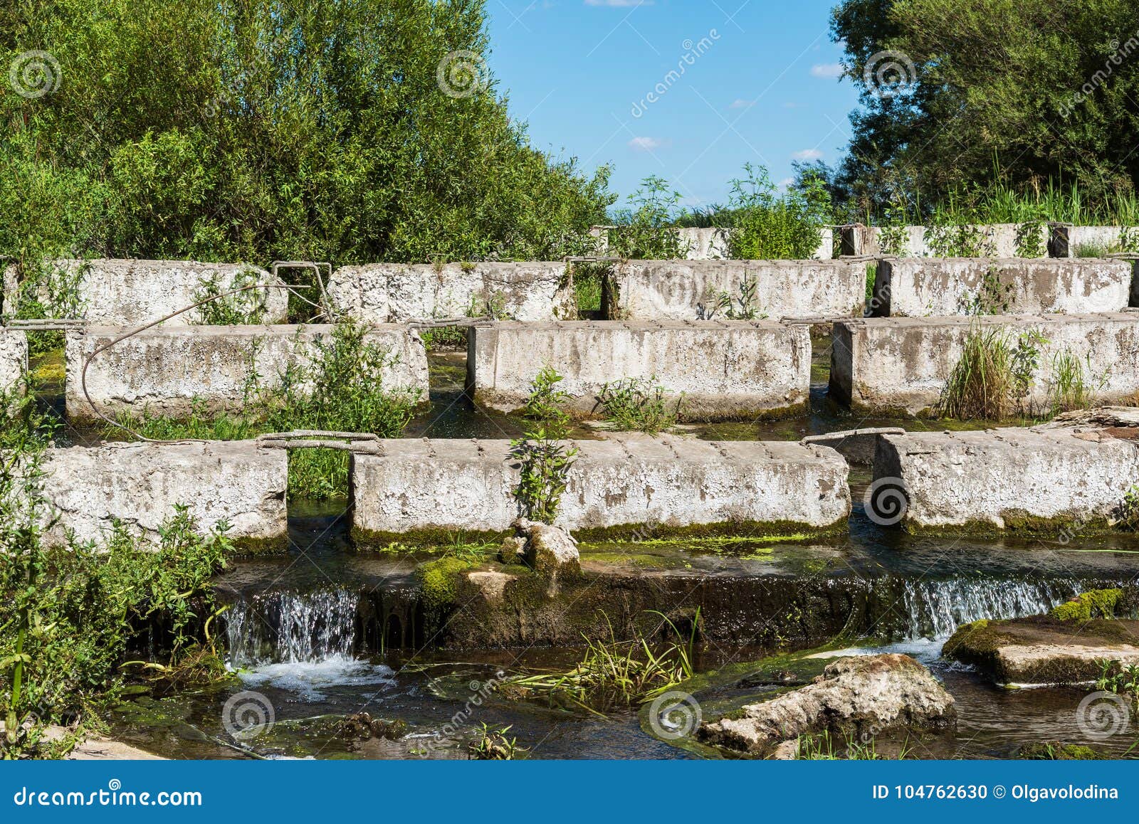 Concrete Blocks Lying on a Small River - Dam Stock Photo - Image of ...
