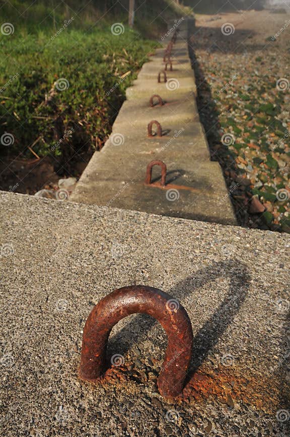 Concrete Blocks with Metal Hooks on Beach Stock Image - Image of solid ...