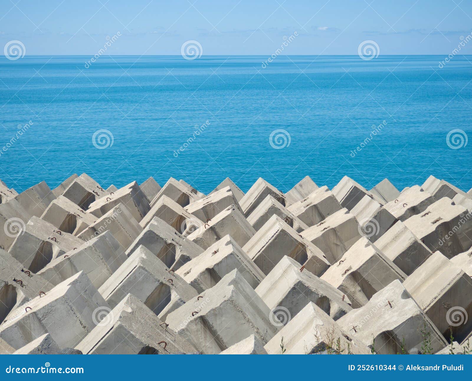 Concrete Breakwaters and Heaps of Stones on the Shore. Shore Protection ...