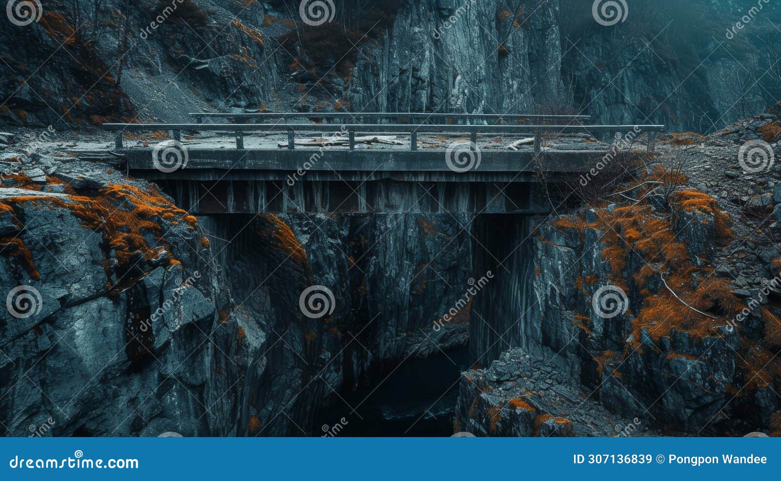 A Concrete Bridge Over a Deep Rocky Gorge with Mist and Moss Stock ...