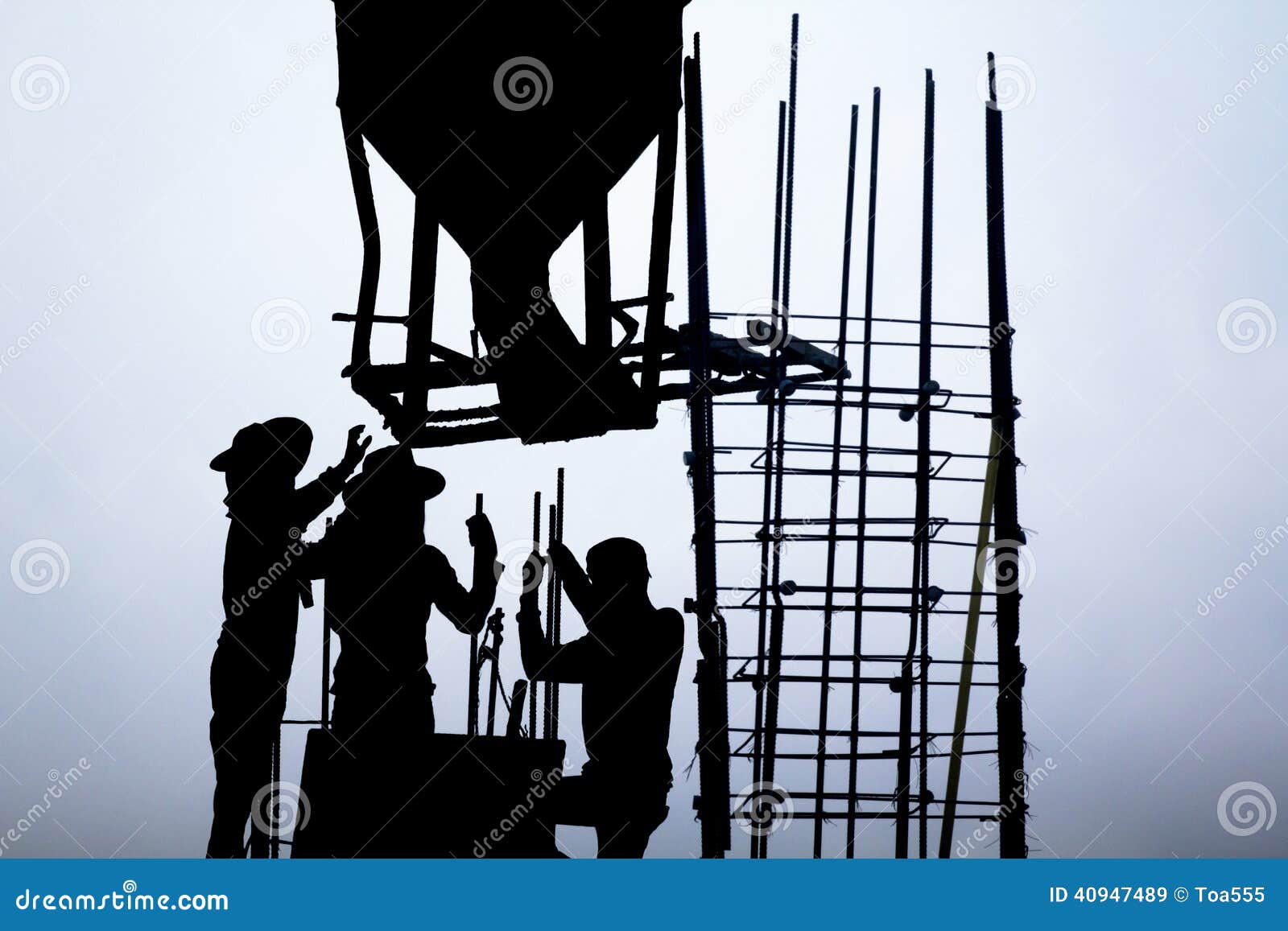 Concrete Bucket Above Workers in Construction Site Stock Image - Image ...