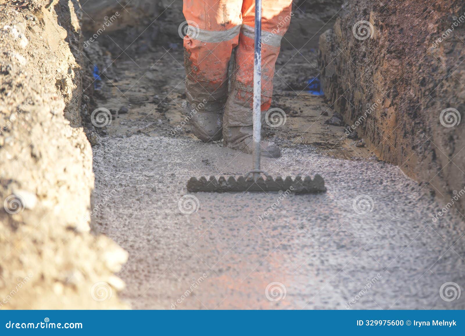 Concrete Cast-in-place Work. Builder Leveling Wet Concrete. Concrete ...
