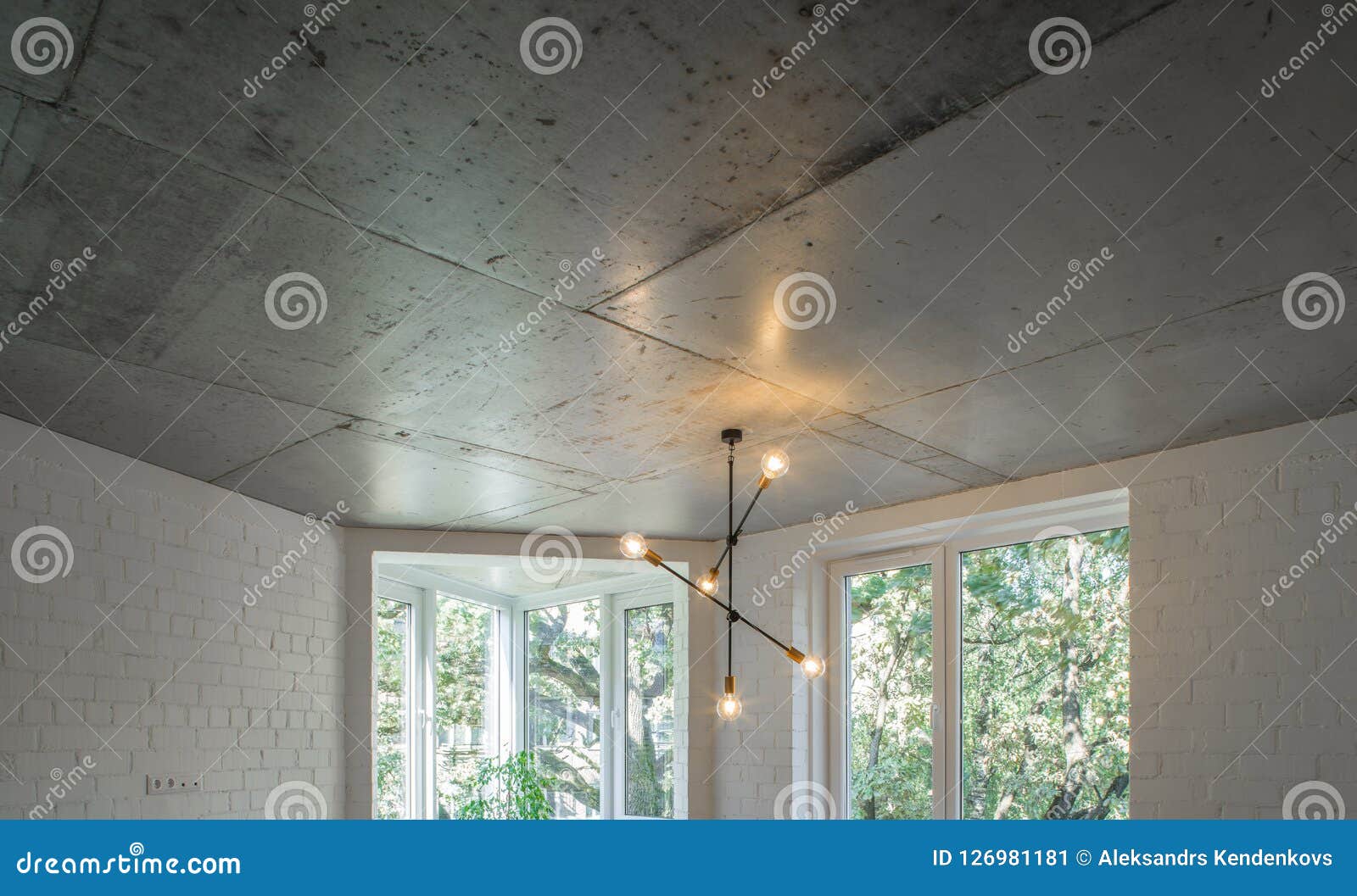 Concrete Ceiling and Lighting in a Modern Apartment. Concrete Style in the Apartment. Stock ...