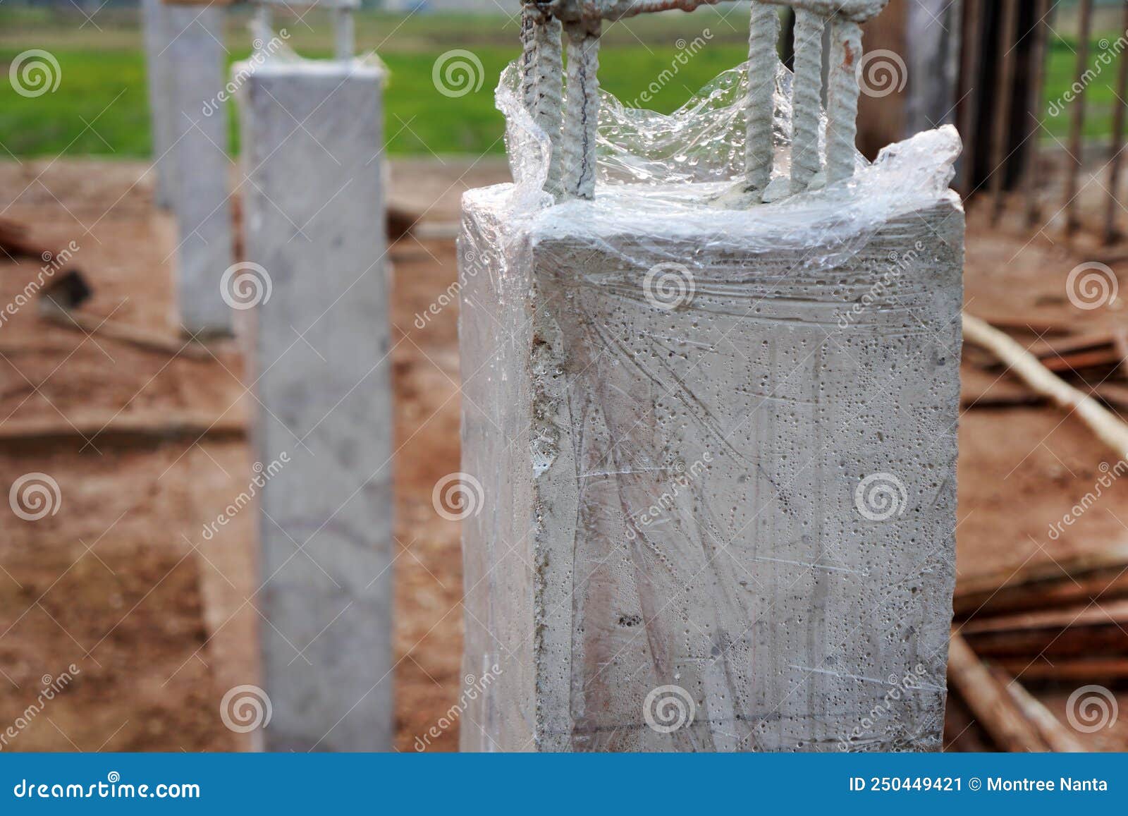 Concrete Columns at the Construction Site are Covered with Plastic ...
