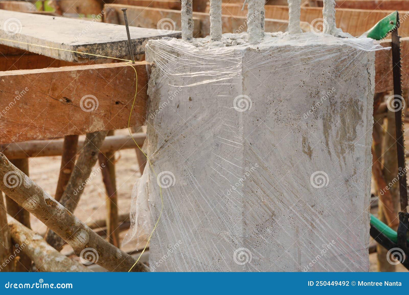 Concrete Columns at the Construction Site are Covered with Plastic ...