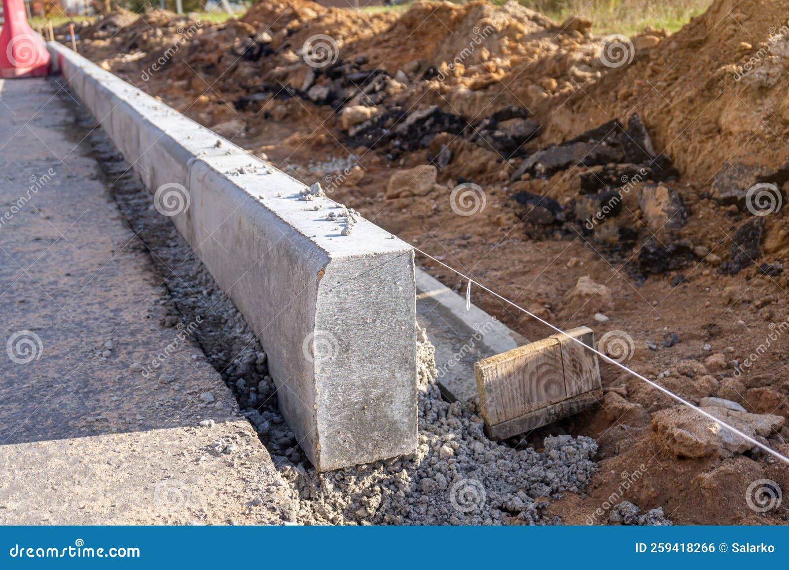 Concrete curb installation stock photo. Image of installation - 259418266