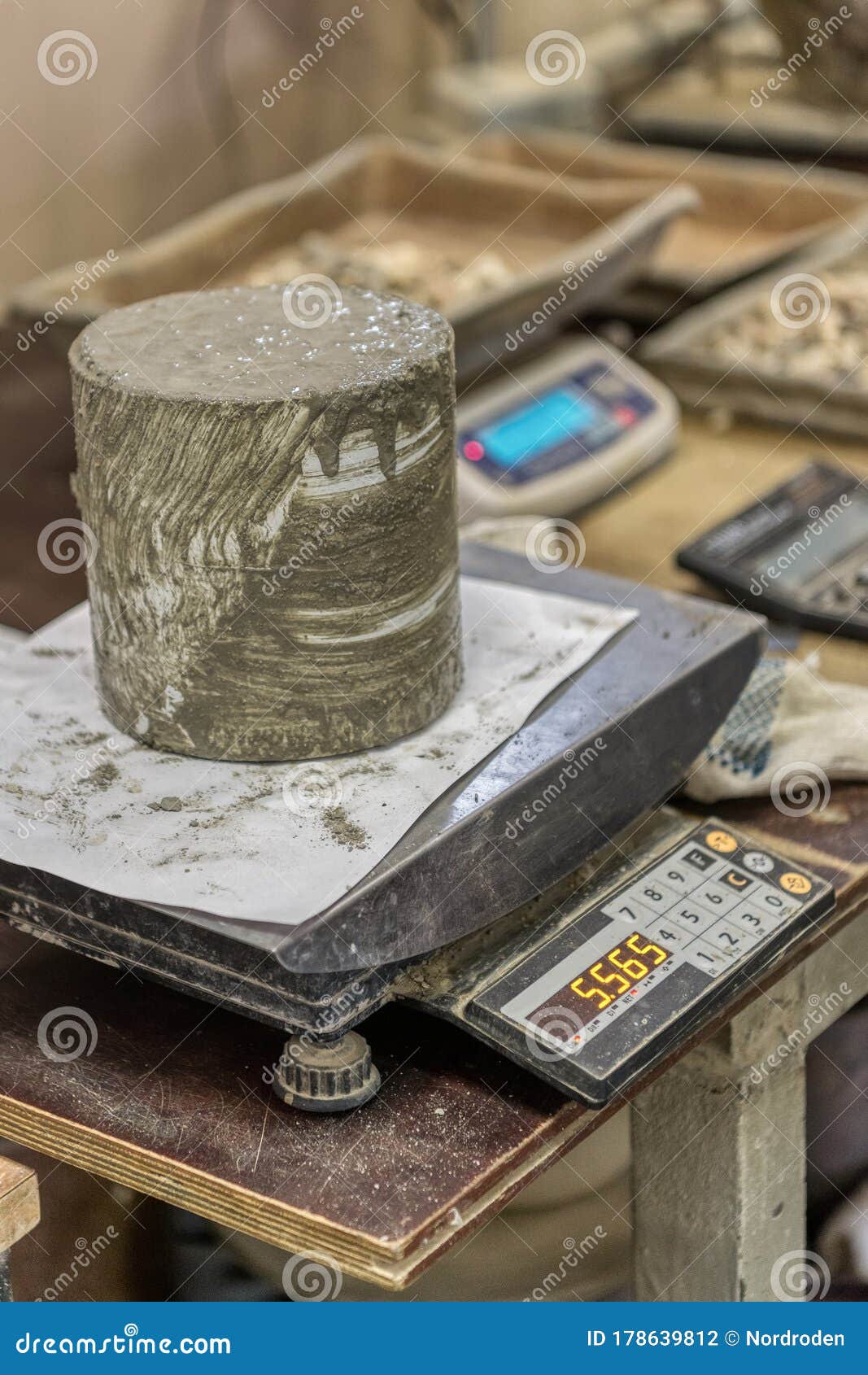The Concrete Cylinder is Weighed on an Electronic Scale. Stock Photo ...