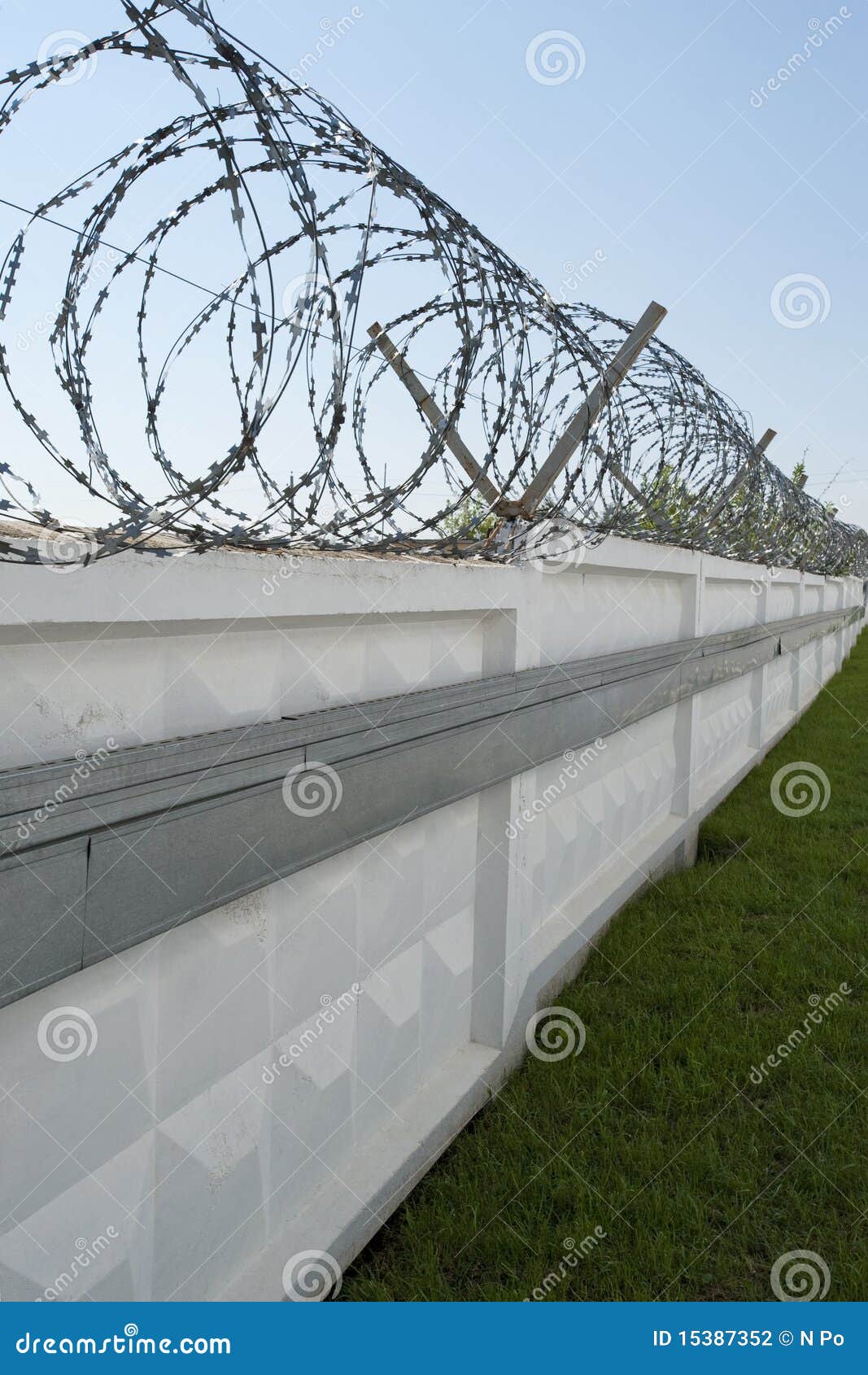 Concrete Fence with Razor Wire Stock Photo - Image of fence, boundary ...