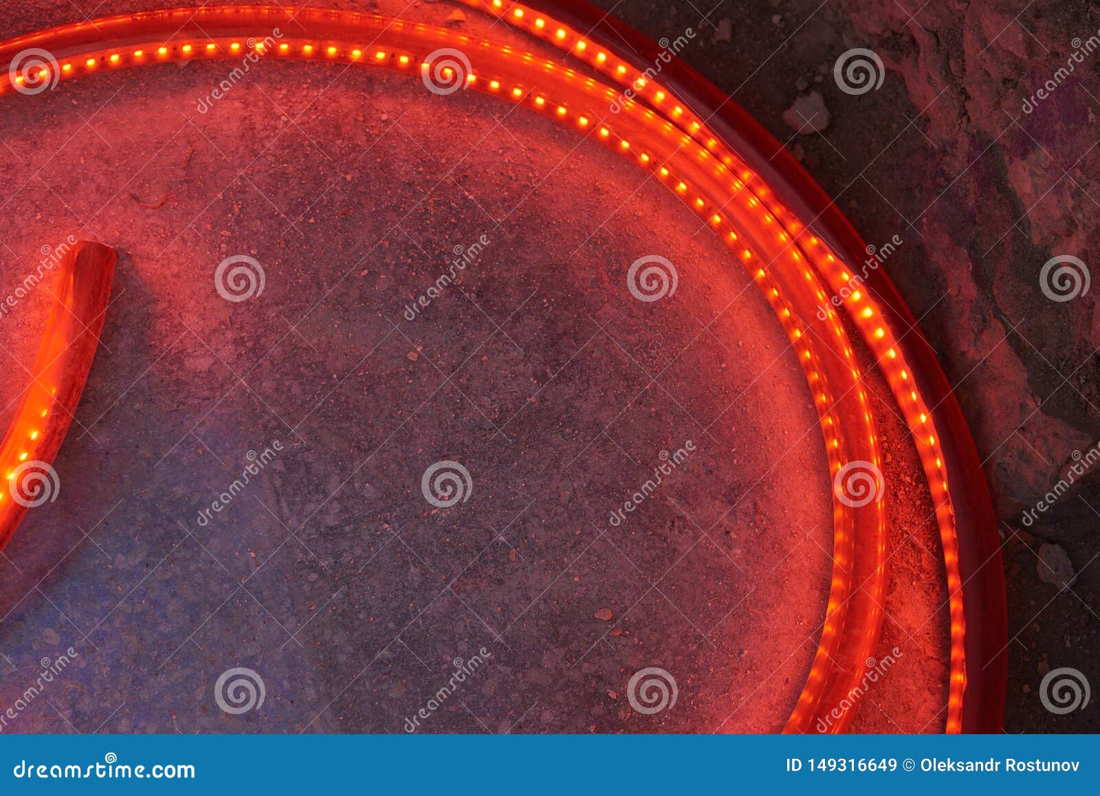 On the Concrete Floor is a Plastic Tube. Inside the Tube are Red LEDs ...