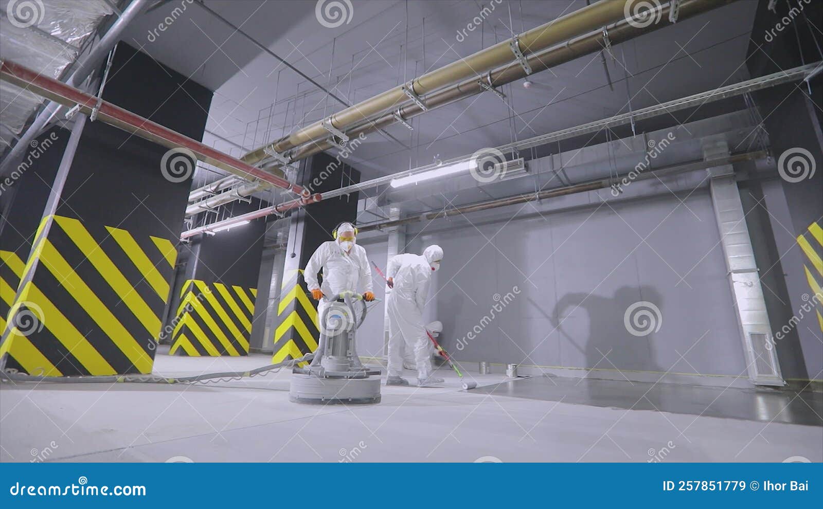 Concrete Floor Processing during Construction. Grinding a Concrete ...