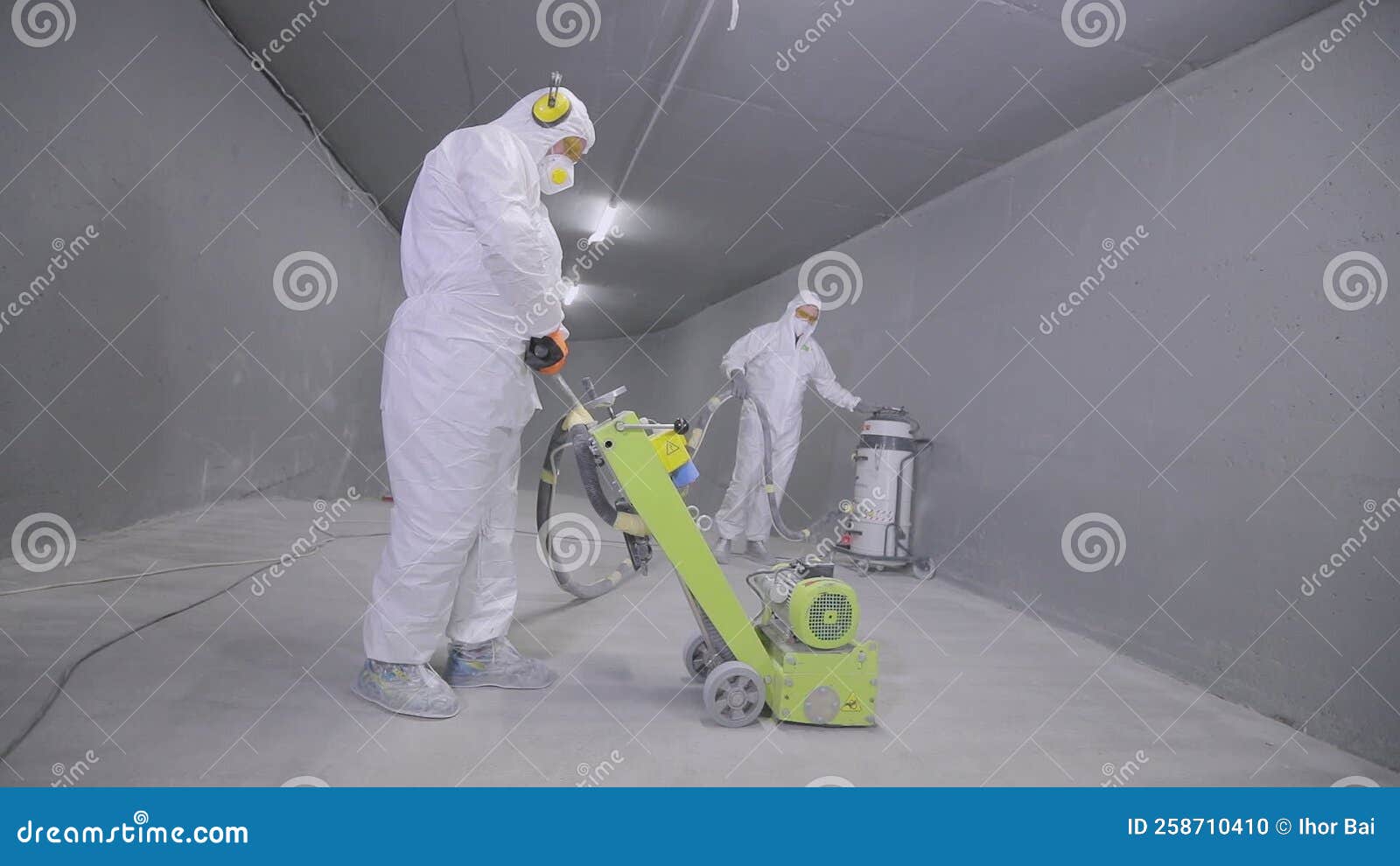 Concrete Floor Processing during Construction. Grinding a Concrete ...