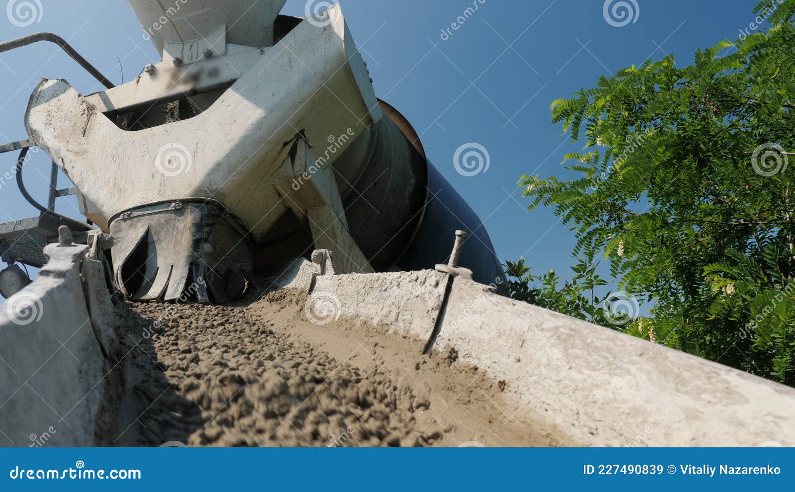 Concrete Flows from the Concrete Mixer through the Trough, Concrete ...