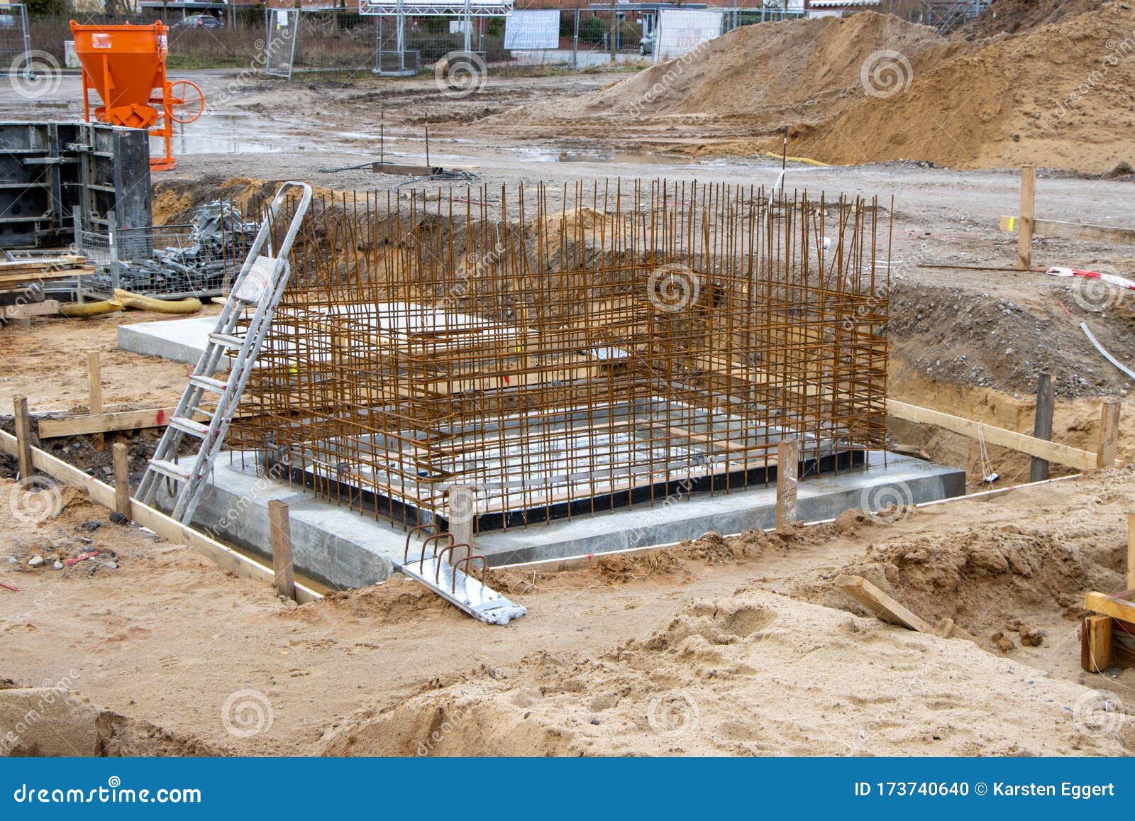 Concrete Foundations for the Columns of a Factory Building are Poured ...