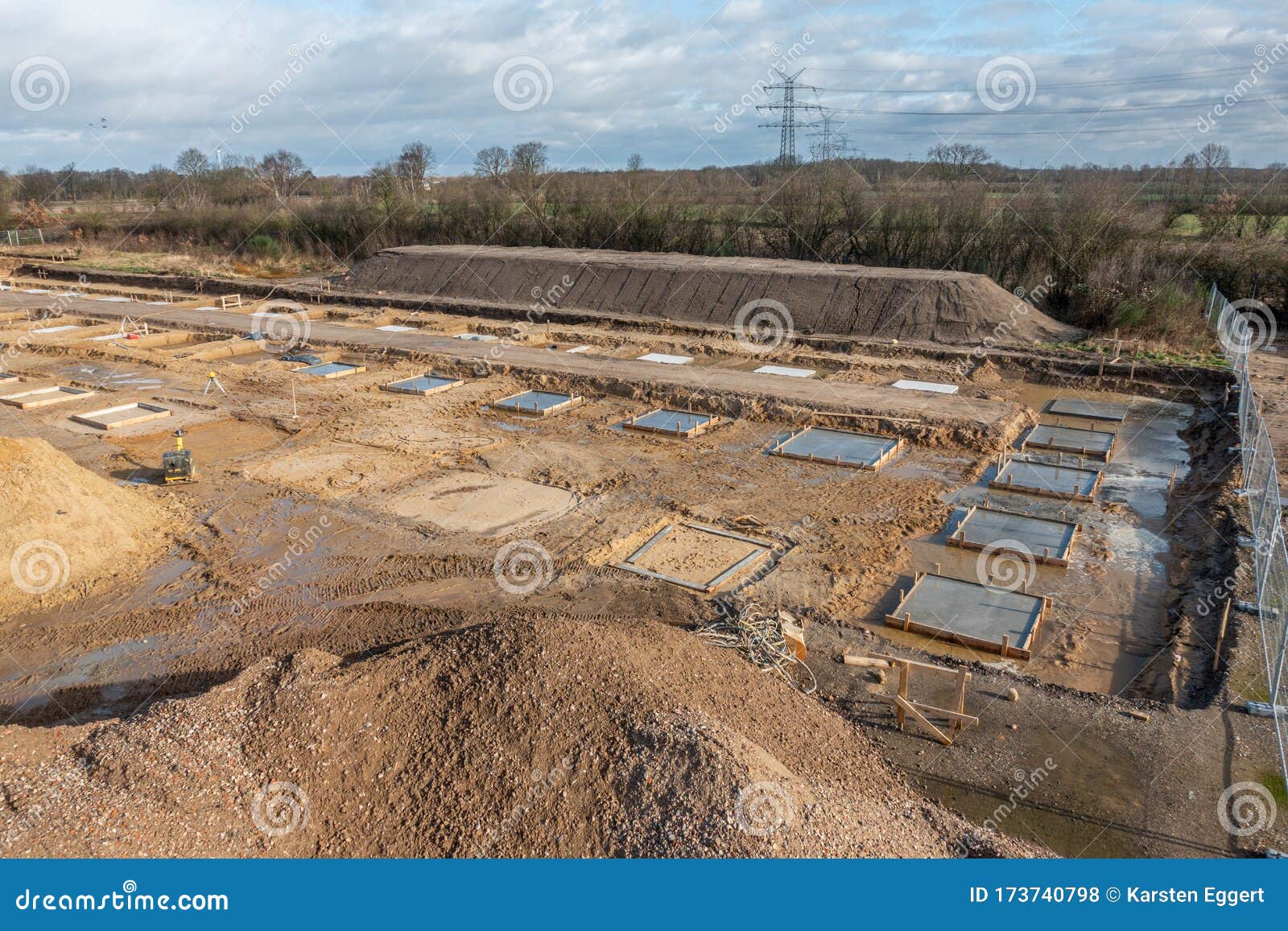 Concrete Foundations for the Columns of a Factory Building are Poured ...