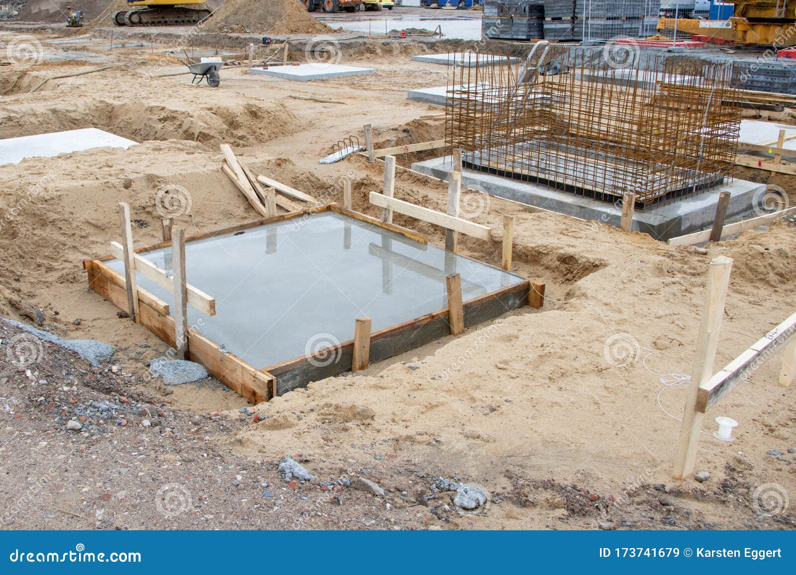 Concrete Foundations for the Columns of a Factory Building are Poured ...