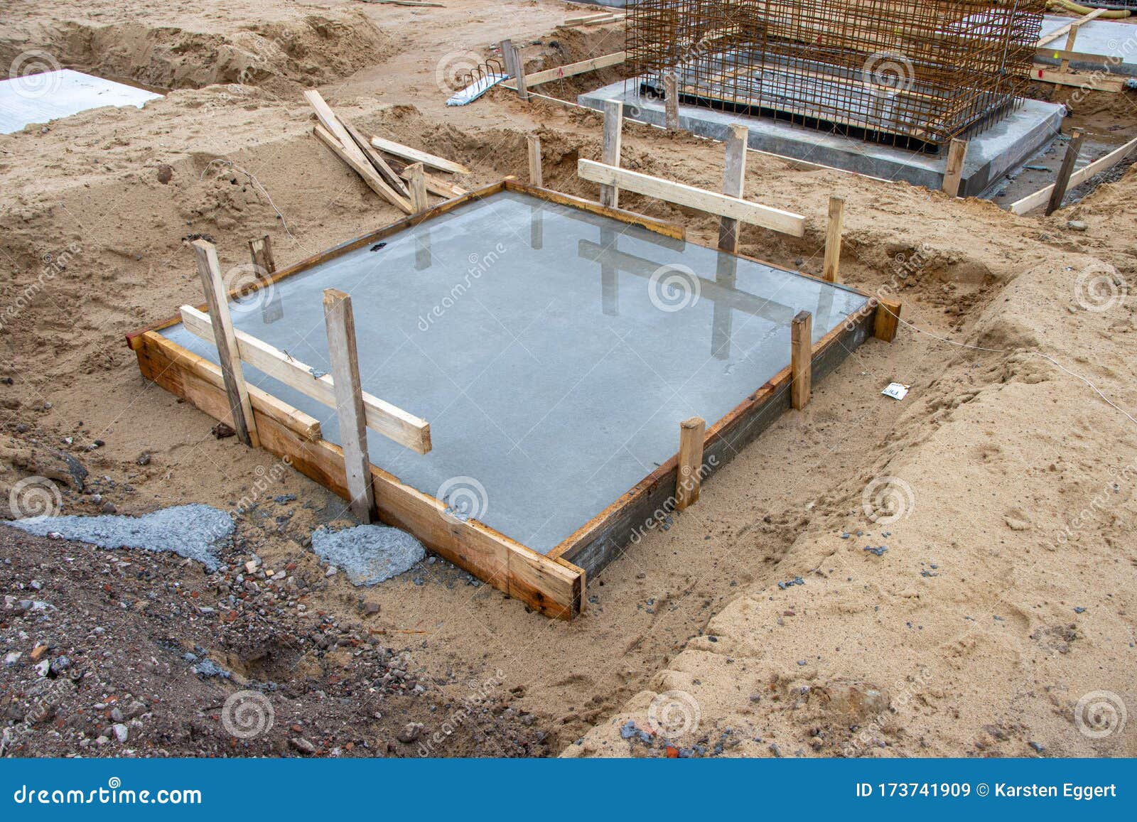 Concrete Foundations for the Columns of a Factory Building are Poured ...