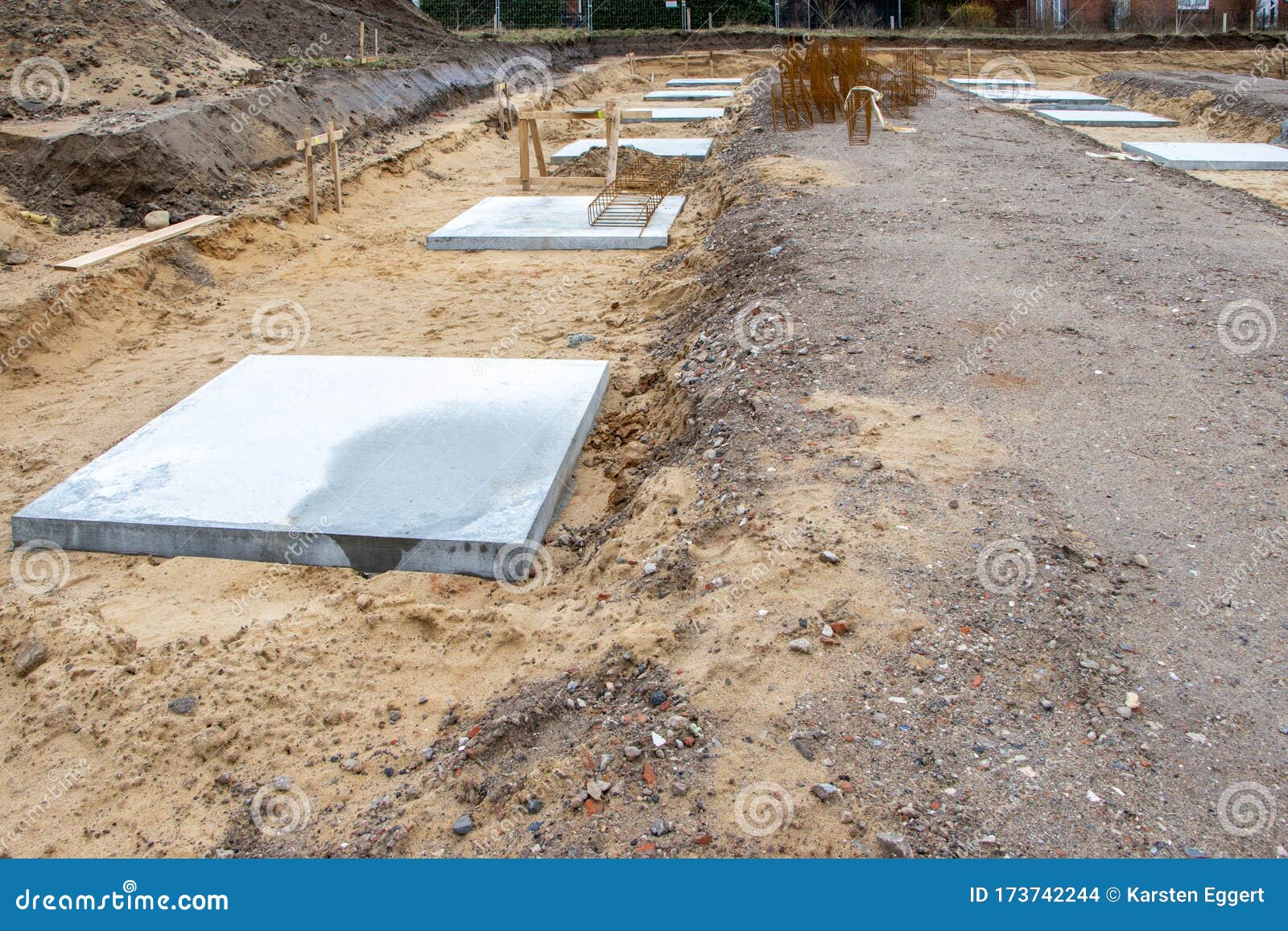 Concrete Foundations for the Columns of a Factory Building are Poured ...