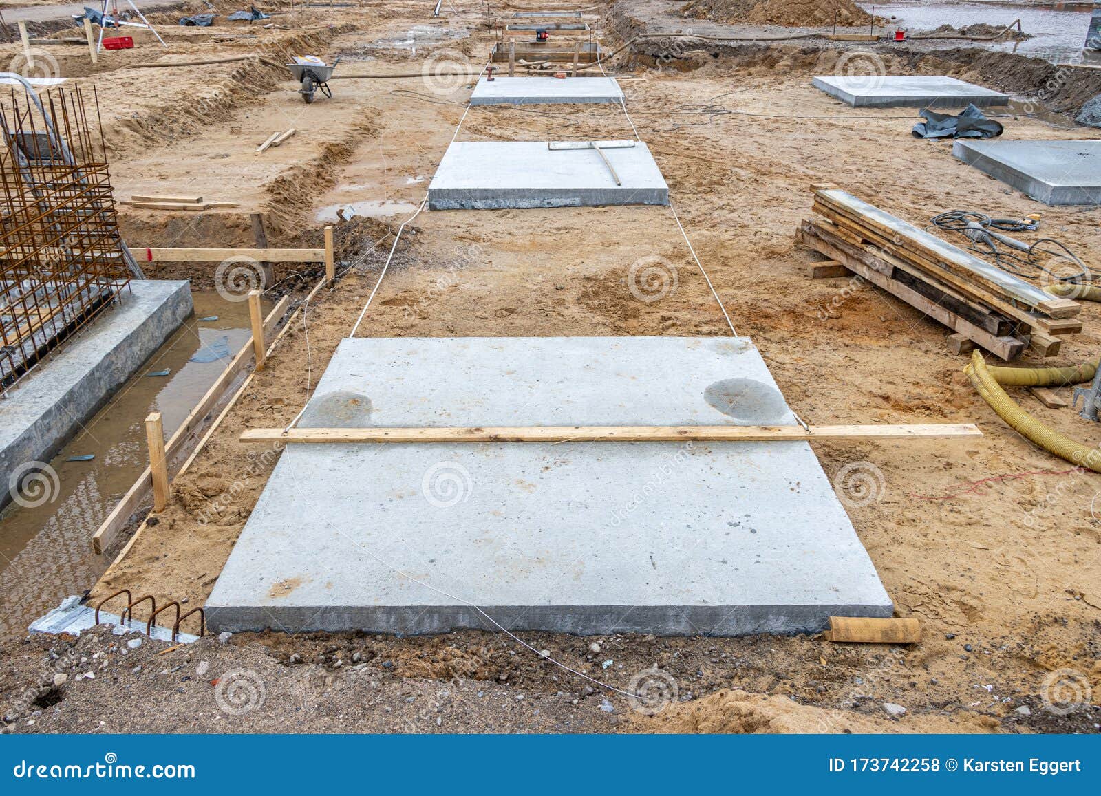 Concrete Foundations for the Columns of a Factory Building are Poured ...