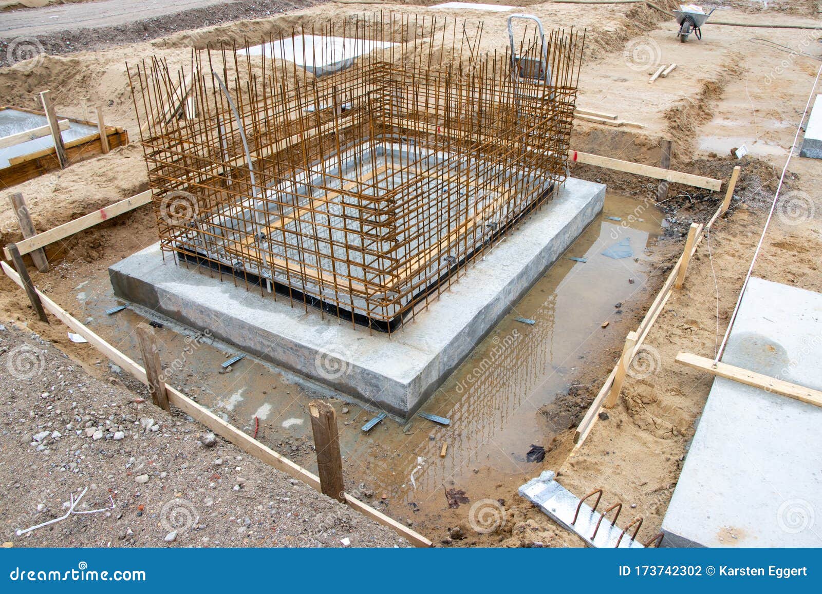 Concrete Foundations for the Columns of a Factory Building are Poured ...