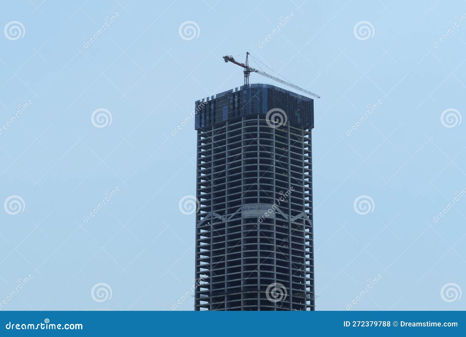 Concrete Frame of a High-rise Building with a Crane at the Top Stock ...