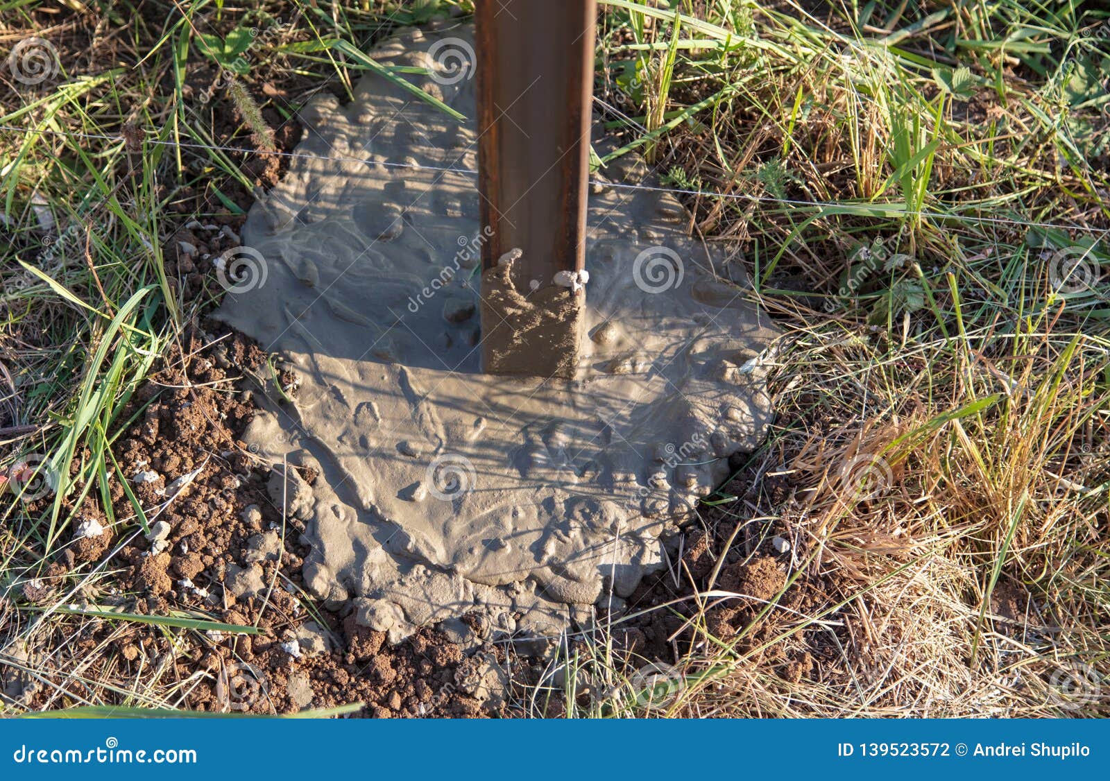 Concrete in the Ground for the Fence Stock Photo - Image of ...