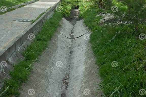 Concrete Gutter Next To the Path, Green Grass Stock Image - Image of ...