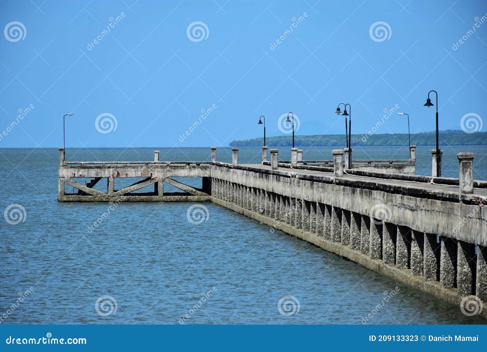 Concrete Jetty into the Sea on Blue Sky Background Stock Image - Image ...