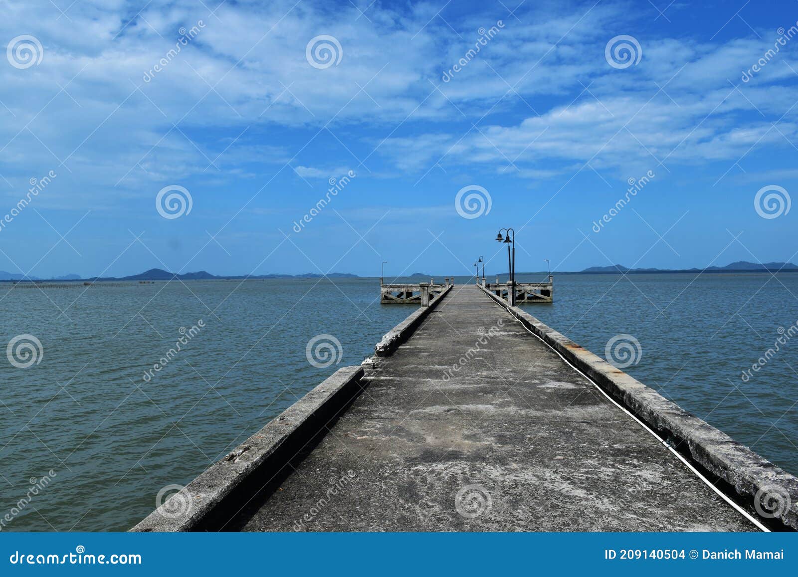 Concrete Jetty into the Sea on Blue Sky Background Stock Photo - Image ...