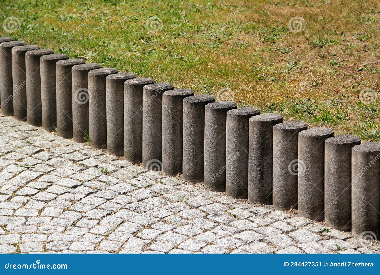 Concrete Kerb between Lawn and Cobbled Sidewalk in a Park Stock Image ...