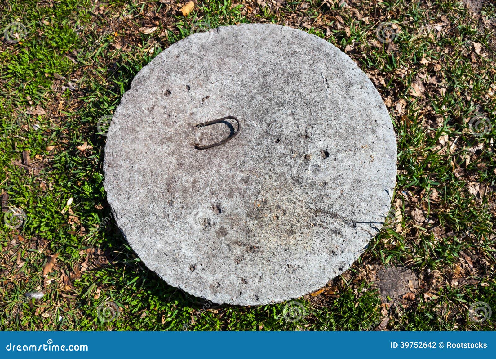 Concrete Manhole Cover in the Grass Stock Photo - Image of manhole ...